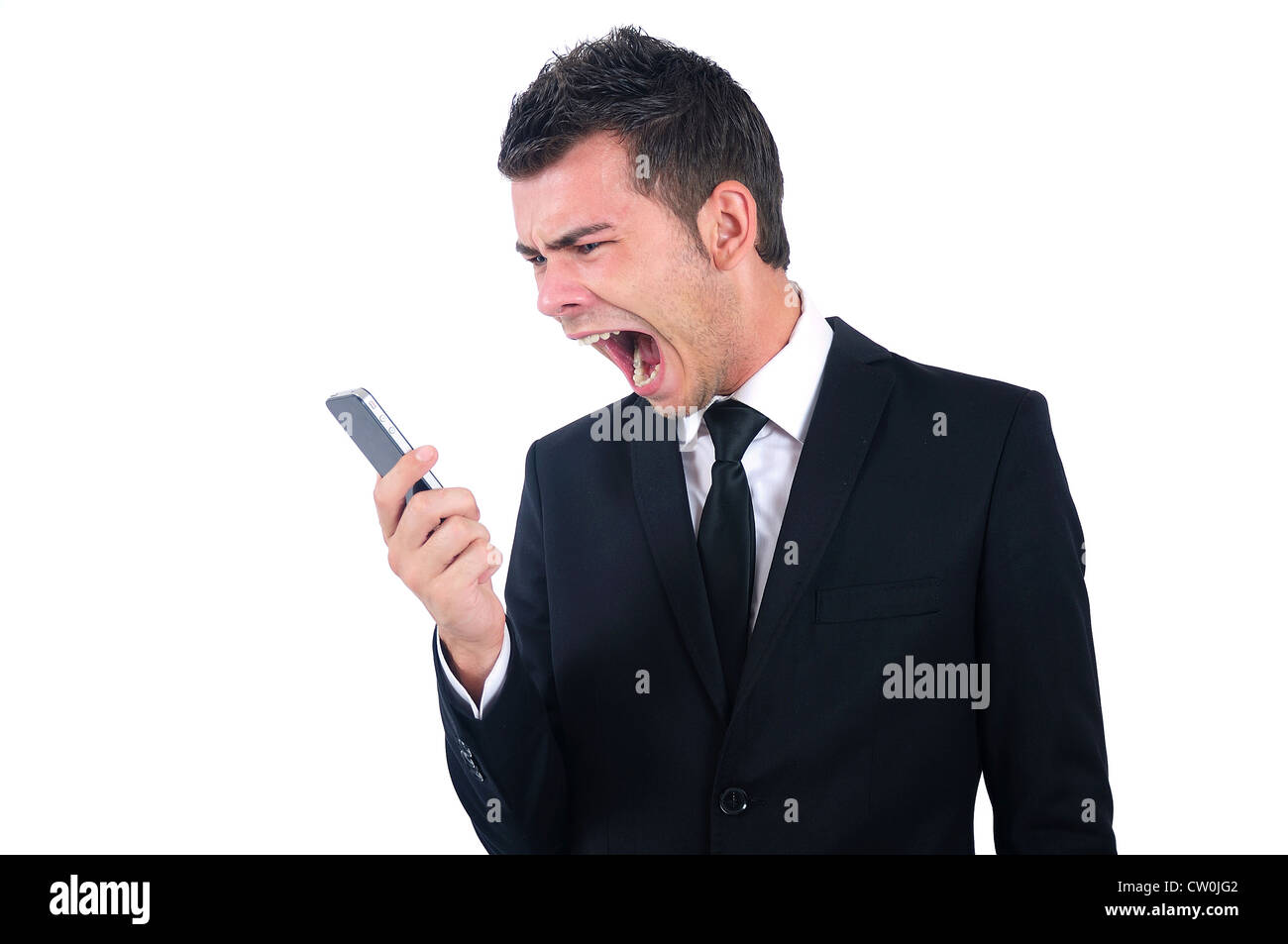 Isolated young business man screaming at phone Stock Photo - Alamy