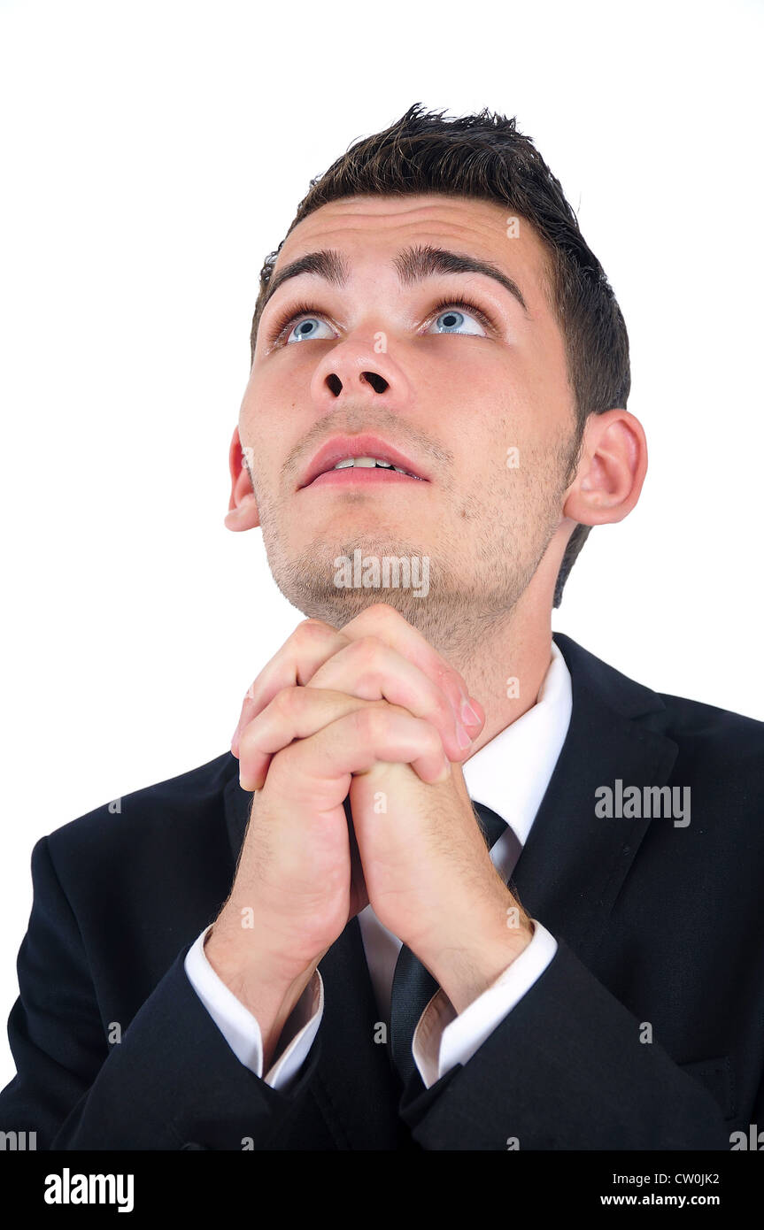Isolated young business man praying Stock Photo - Alamy