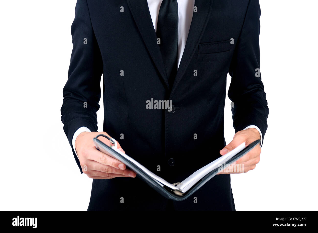 Isolated business man standing with notebook Stock Photo - Alamy