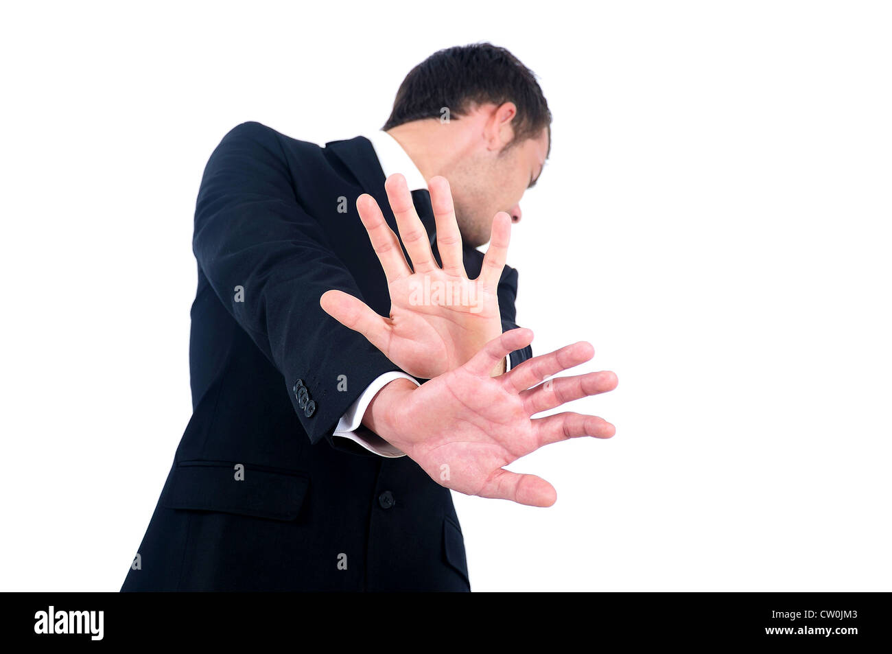 Isolated young business man stop sign Stock Photo - Alamy