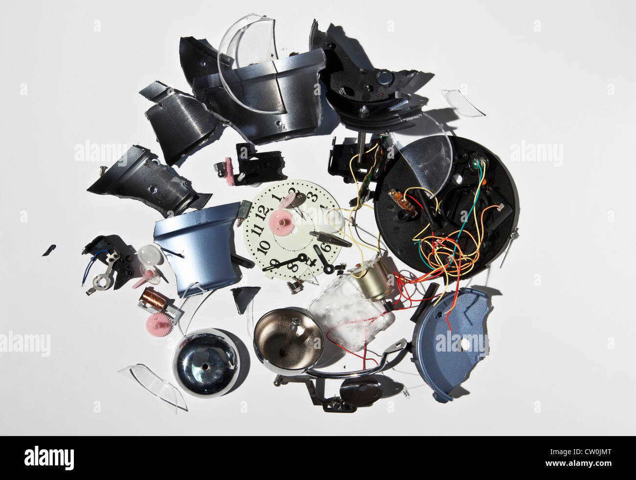 Pile of smashed clock parts Stock Photo - Alamy