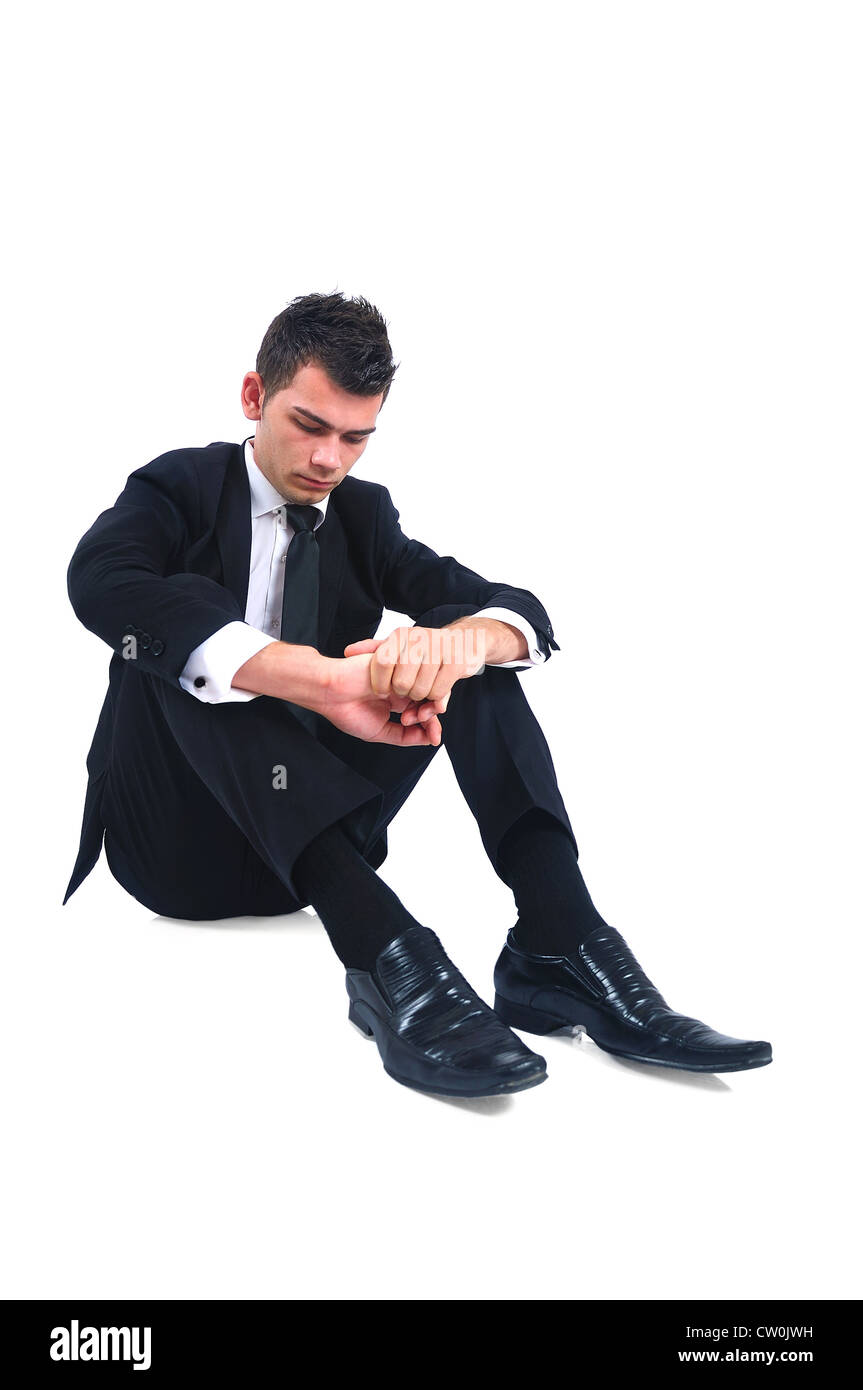 Isolated sad business man sitting down Stock Photo - Alamy