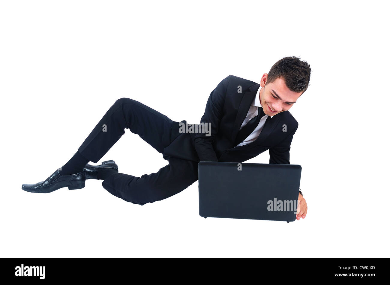Isolated business man smiling at laptop Stock Photo - Alamy