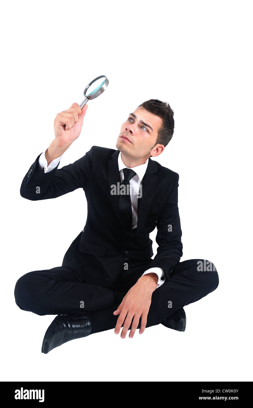 Isolated business man with magnifying glass Stock Photo - Alamy