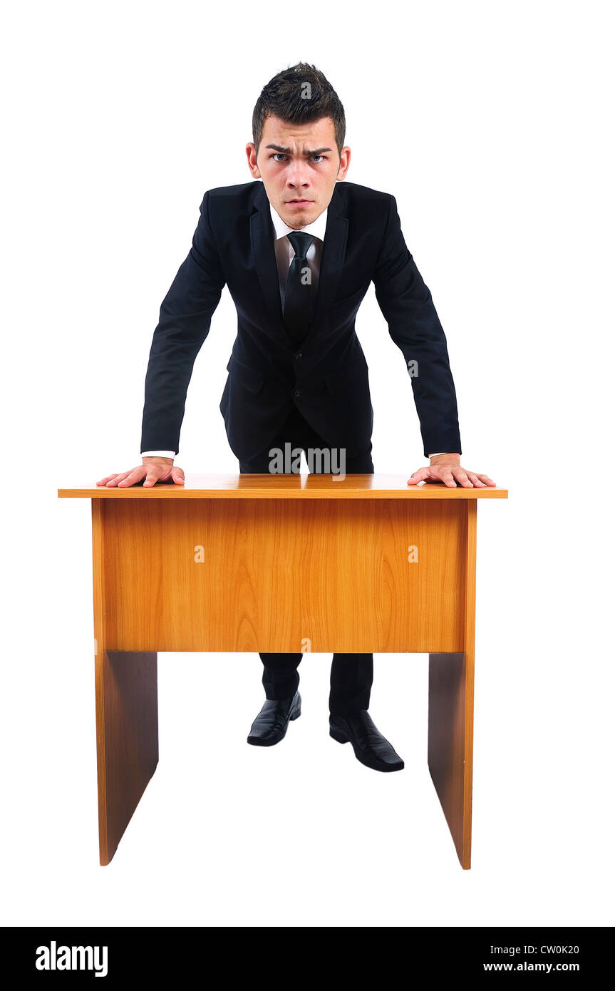 Isolated business man angry at desk Stock Photo - Alamy