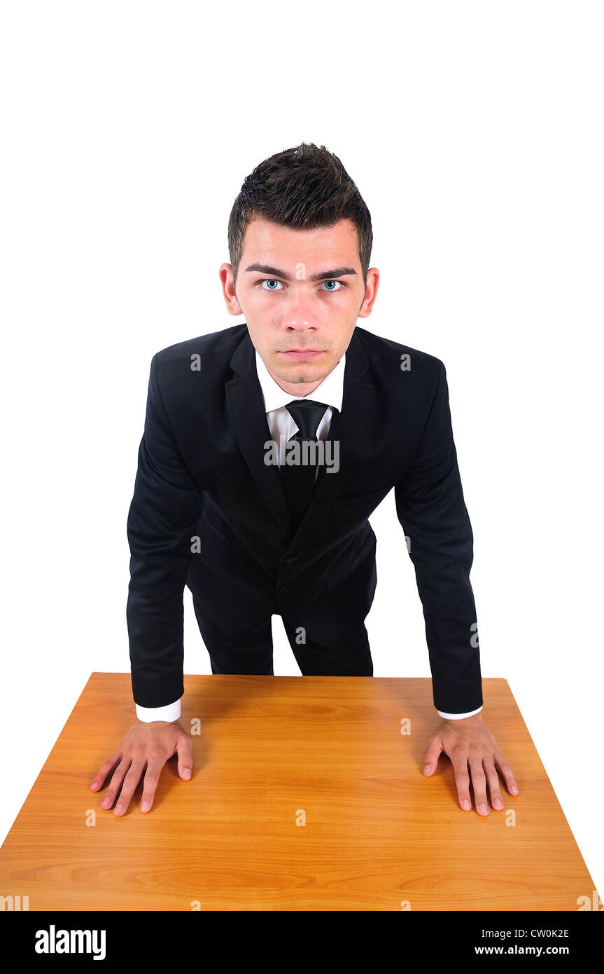 Isolated business man angry at desk Stock Photo - Alamy