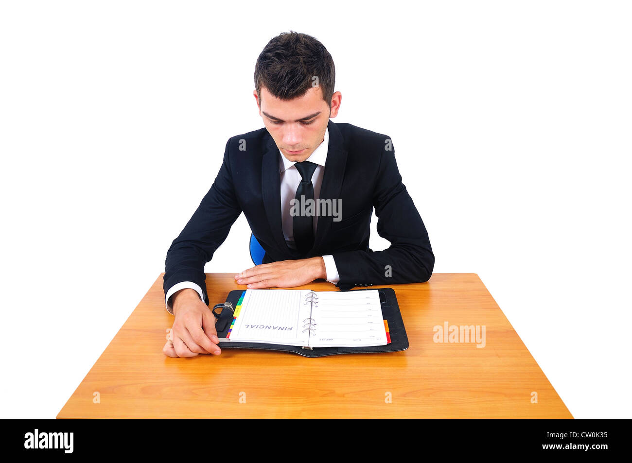 Isolated business man reading at desk Stock Photo - Alamy