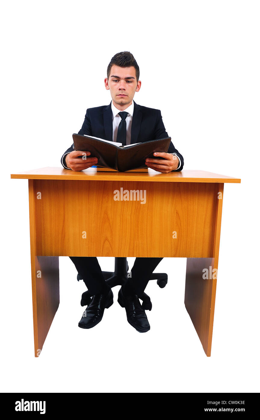 Isolated business man reading at desk Stock Photo - Alamy
