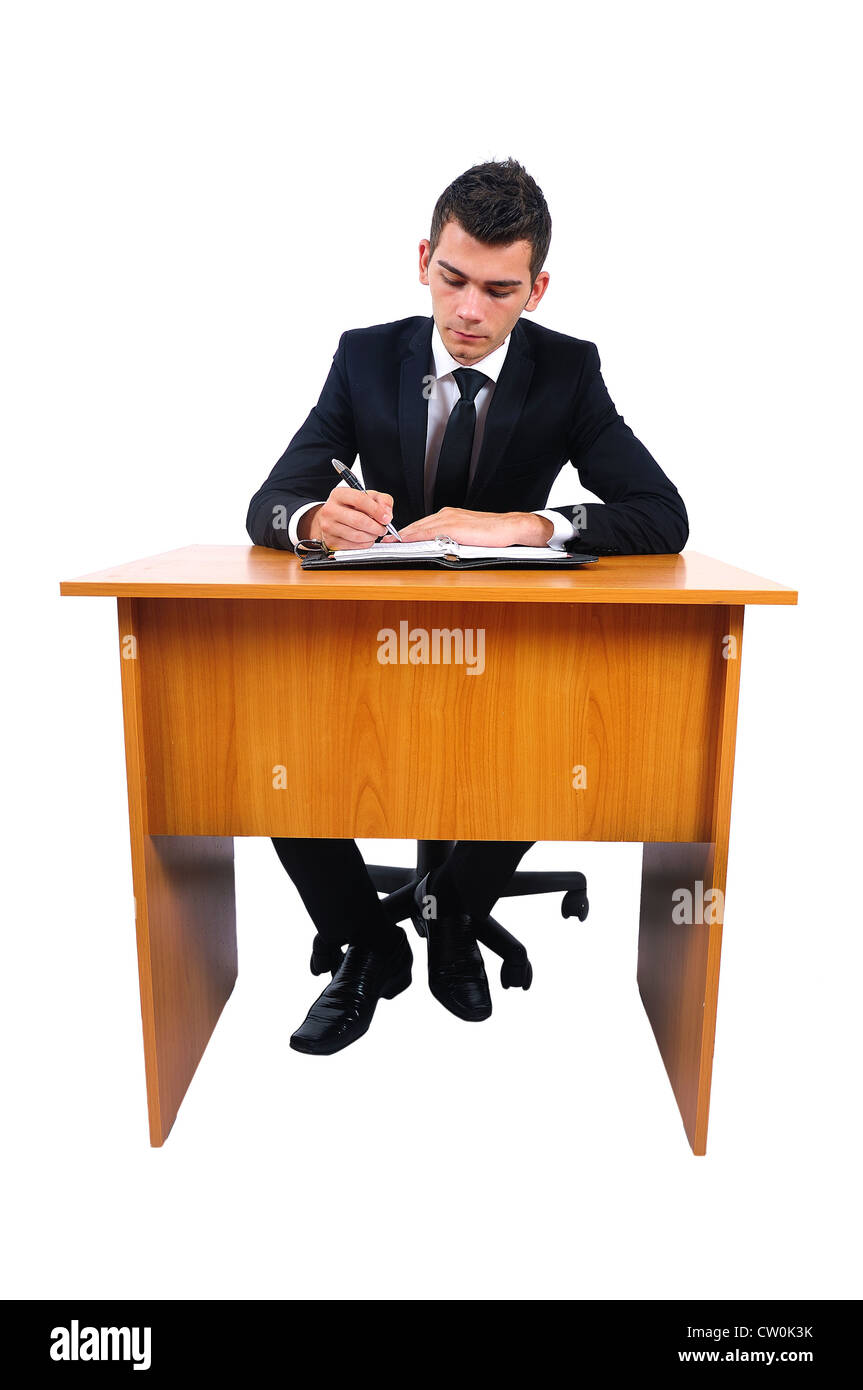 Isolated business man writing at desk Stock Photo - Alamy