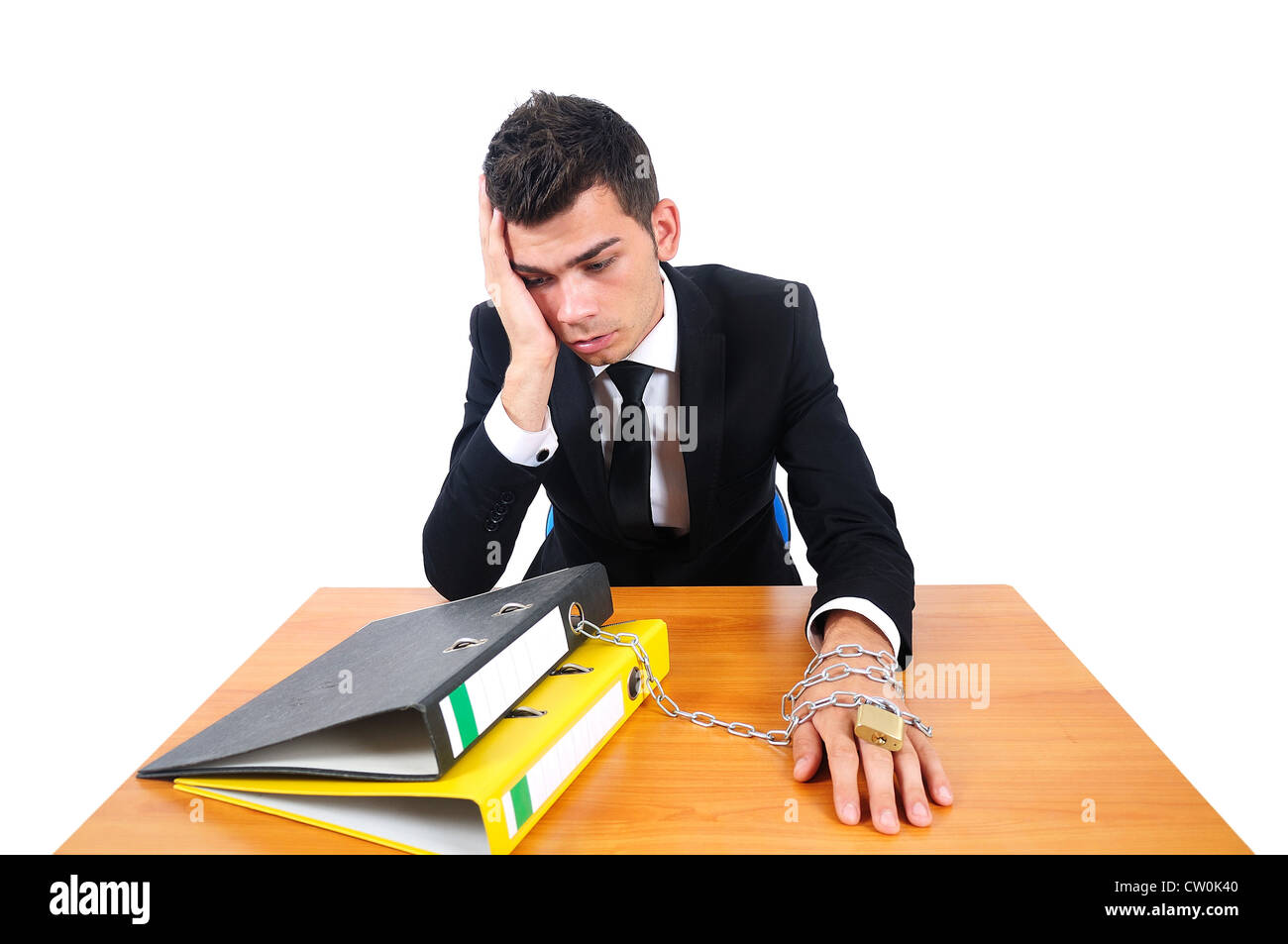 Isolated business man workaholic at desk Stock Photo - Alamy