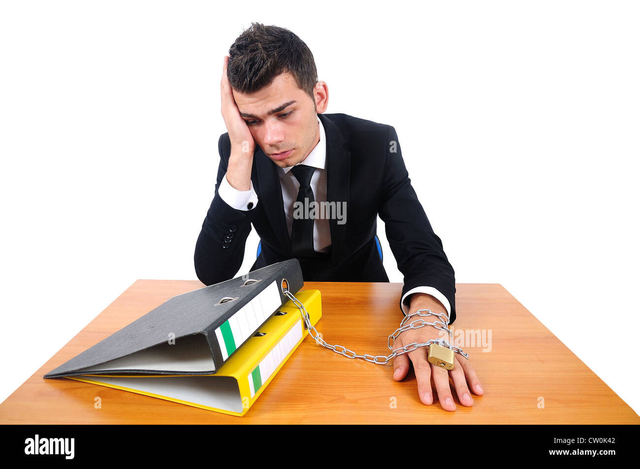 Isolated business man workaholic at desk Stock Photo - Alamy
