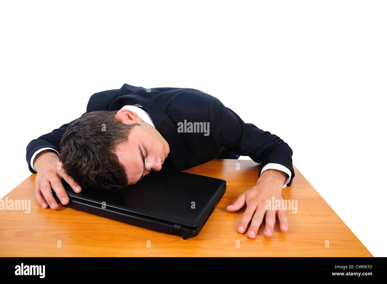Isolated young business man sleeping Stock Photo - Alamy