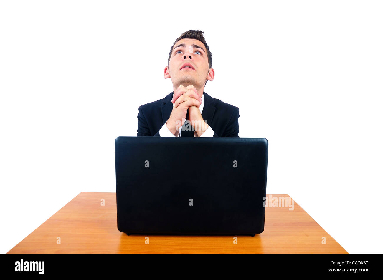 Isolated young business man praying Stock Photo - Alamy