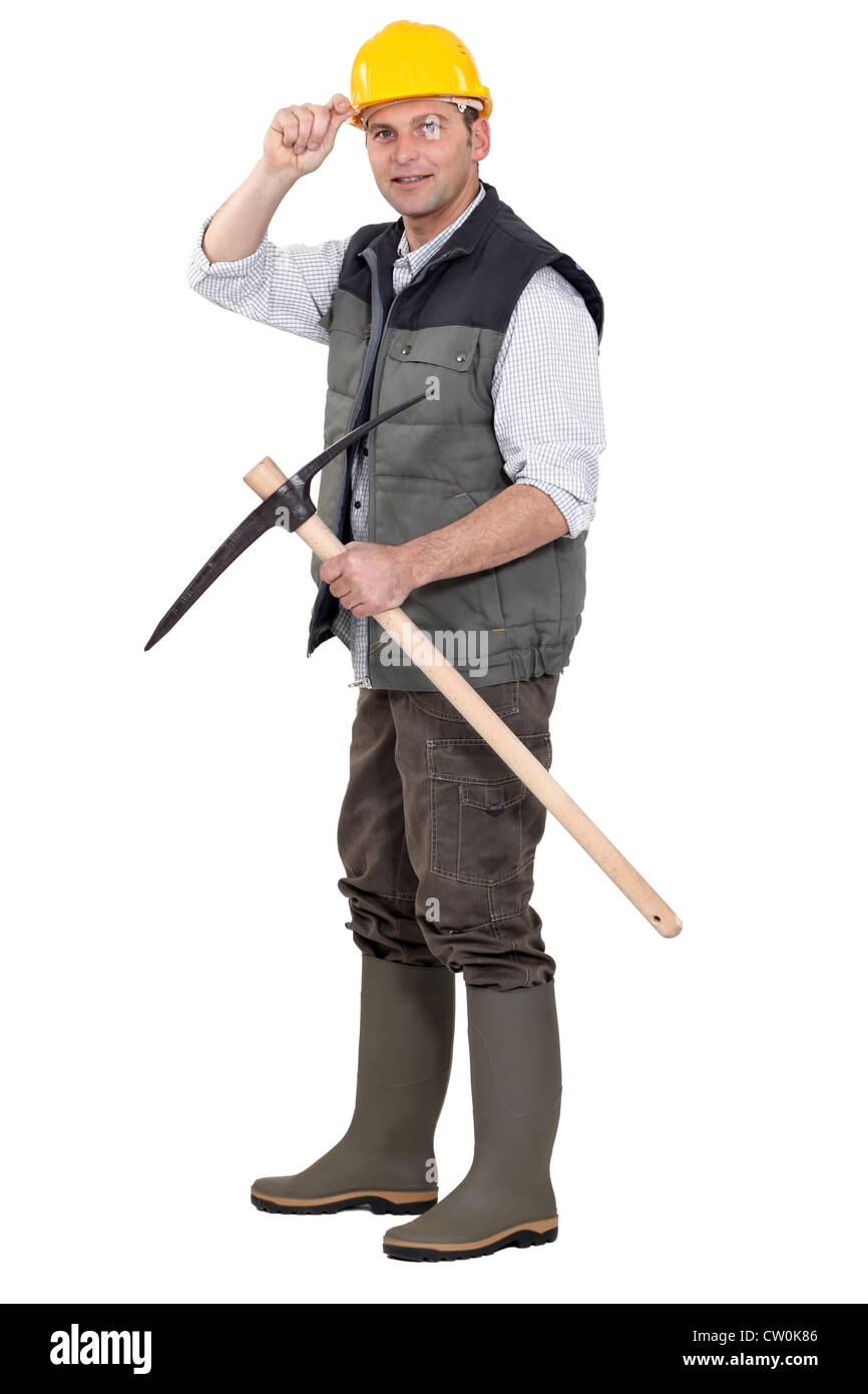Workman with pickaxe on white background Stock Photo - Alamy