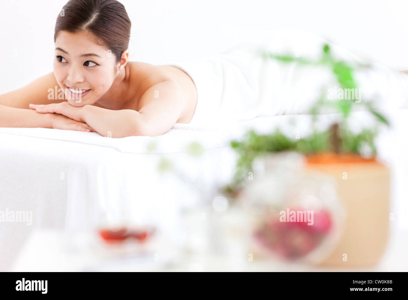 Young woman lying on front Stock Photo - Alamy