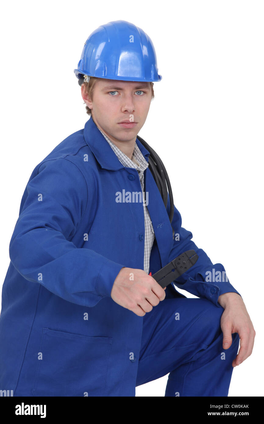 Young laborer, studio shot Stock Photo - Alamy