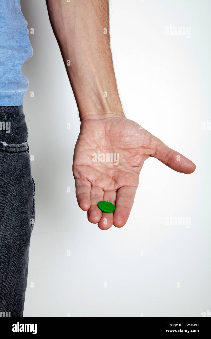 Man holding green Asda Charity Token Stock Photo - Alamy