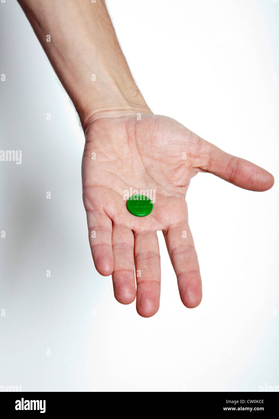 Man holding green Asda Charity Token Stock Photo - Alamy