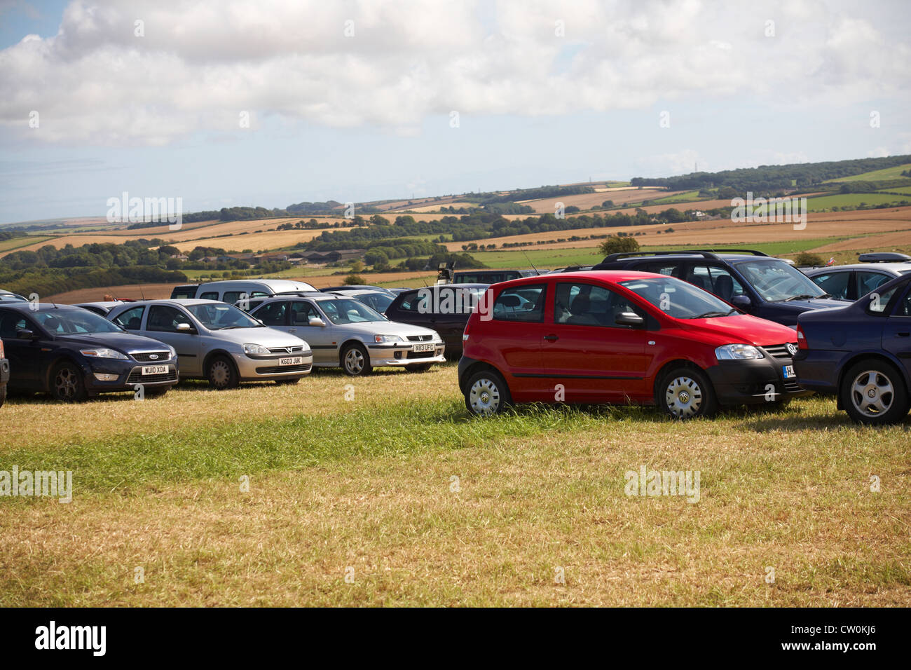 Cars parked in park and road site in beautiful Dorset countryside for ...