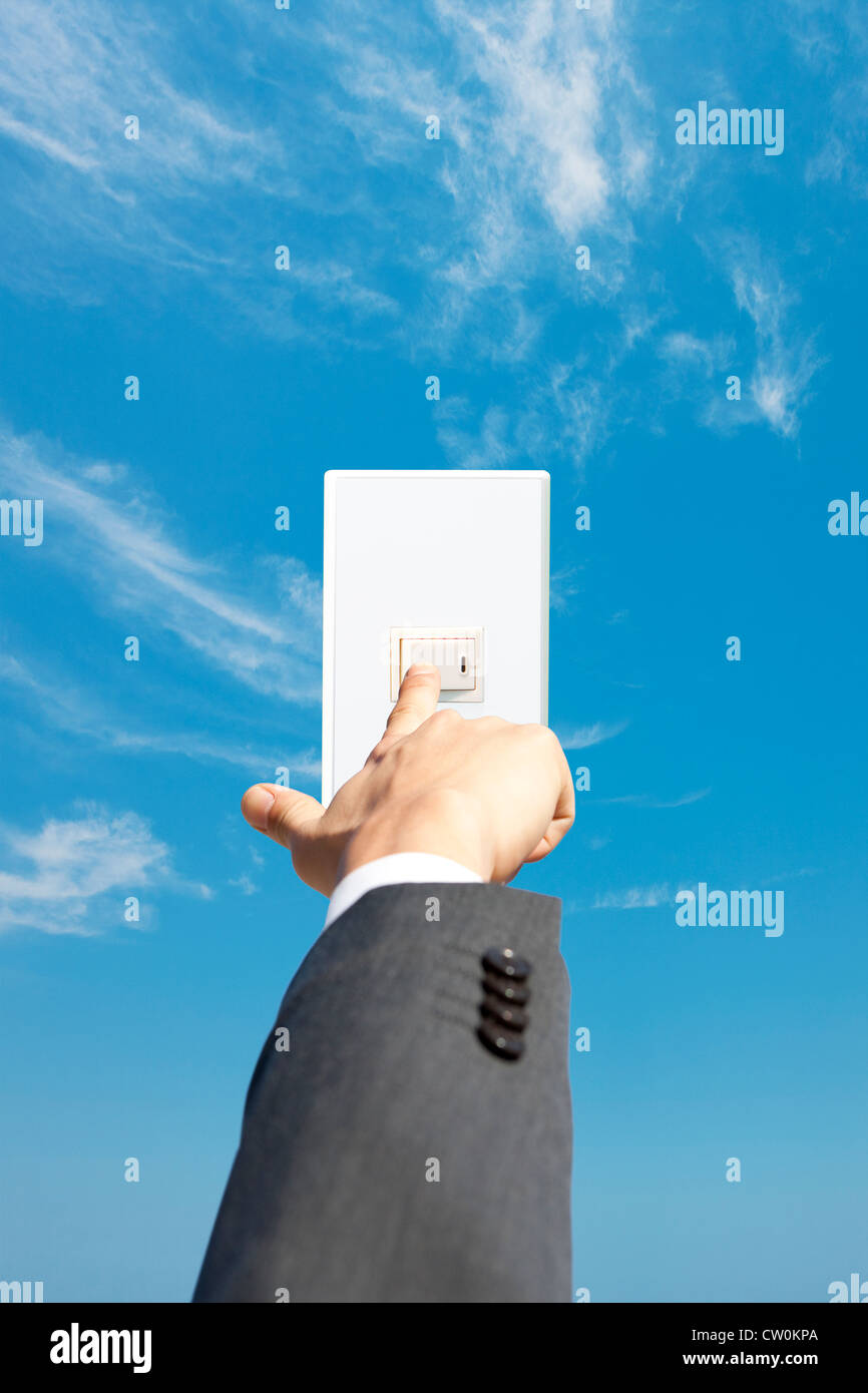 Business men turning off the switch Stock Photo - Alamy