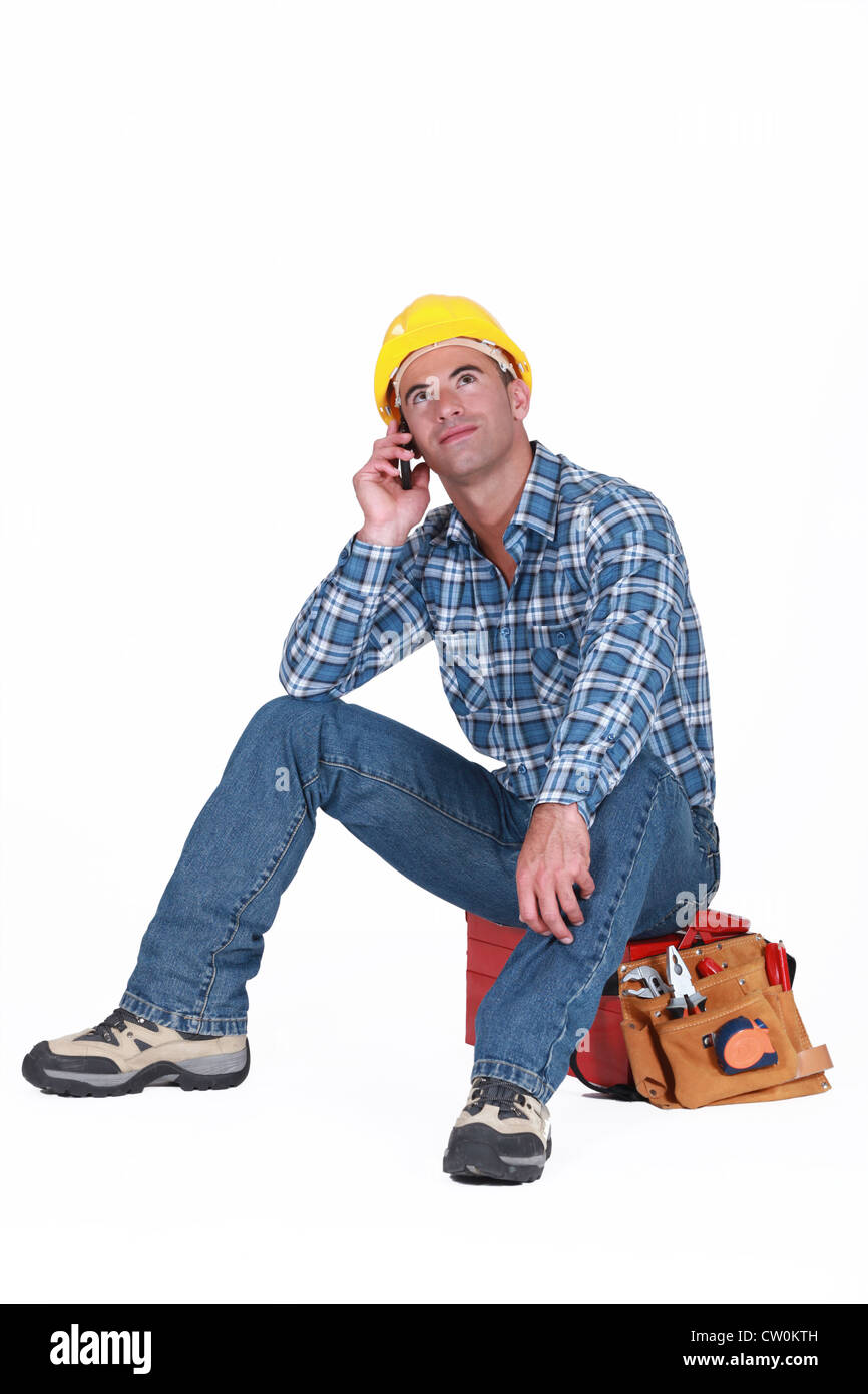 Worker taking a call Stock Photo - Alamy