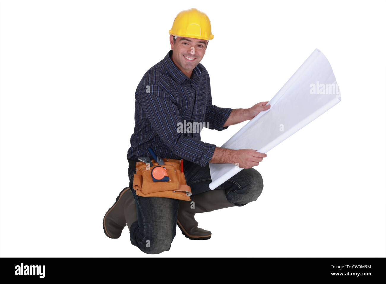 Contractor engineer looking construction drawings hi-res stock ...