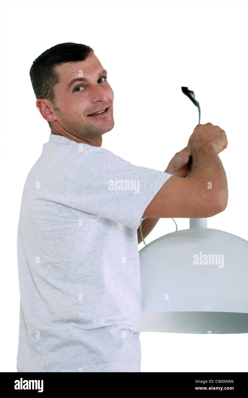 Man fitting light Stock Photo - Alamy