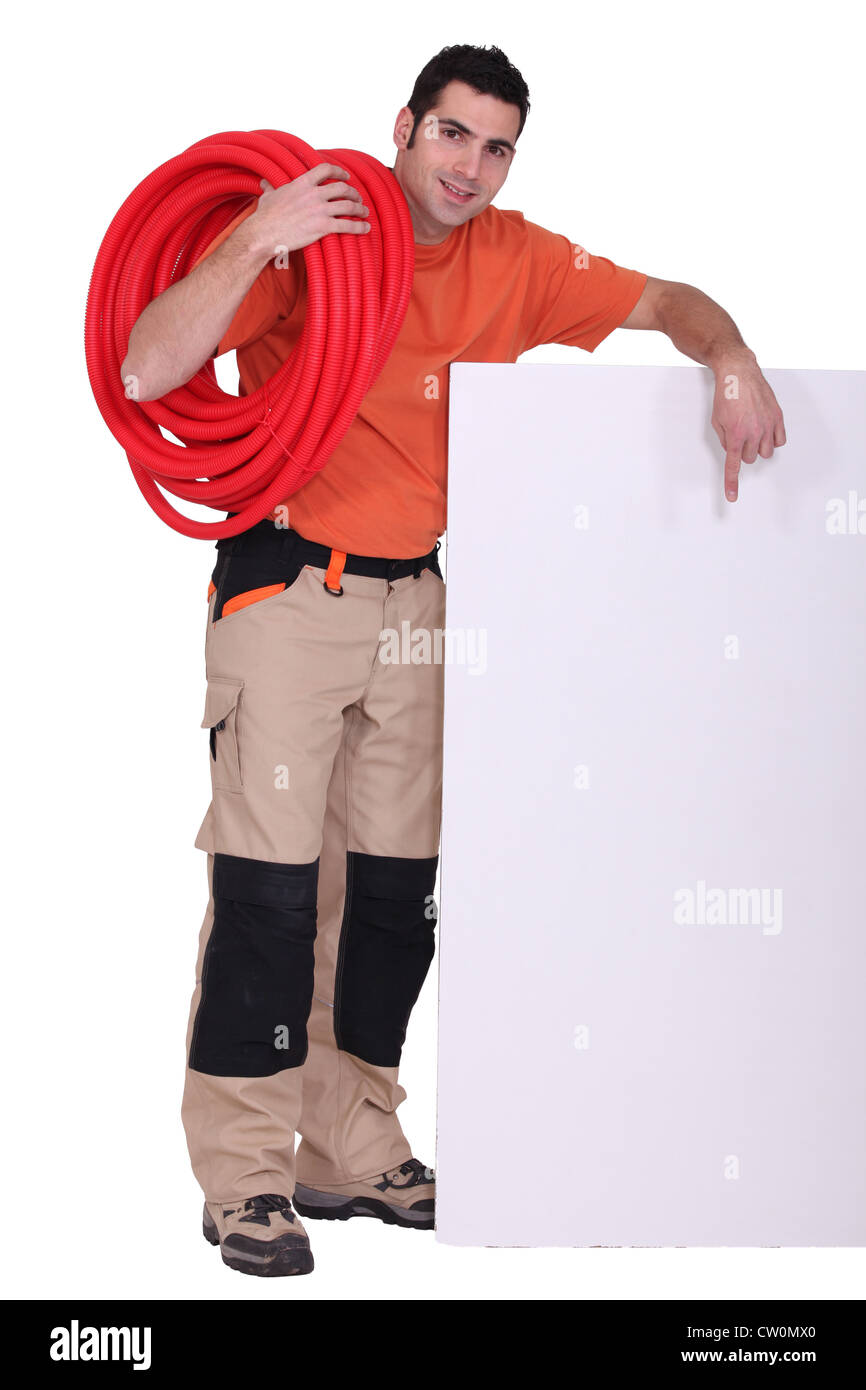 Plumber pointing white board Stock Photo - Alamy