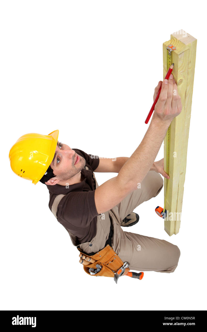 carpenter taking measurements Stock Photo - Alamy