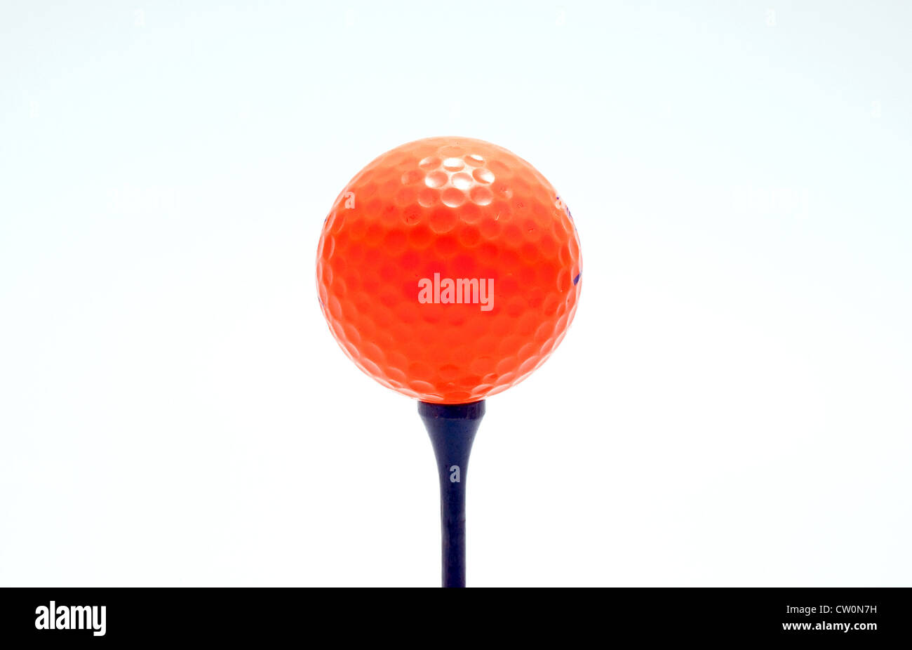 orange golf ball on white background Stock Photo - Alamy