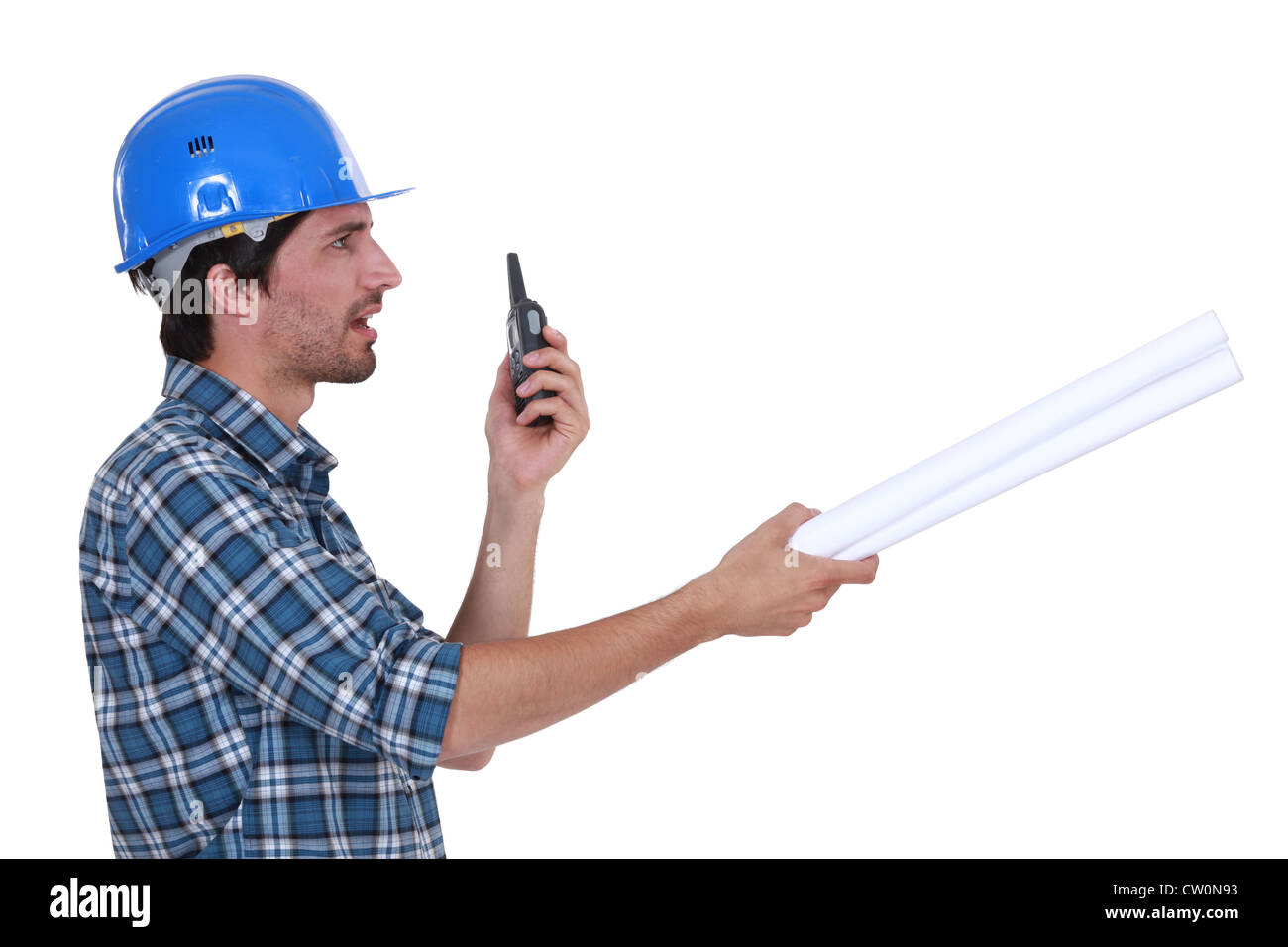 construction supervisor talking on his walkie talkie Stock Photo - Alamy