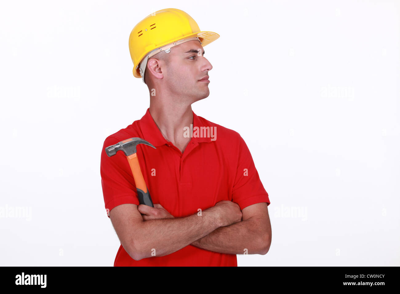 Builder carpenter arms crossed hammer hi-res stock photography and ...