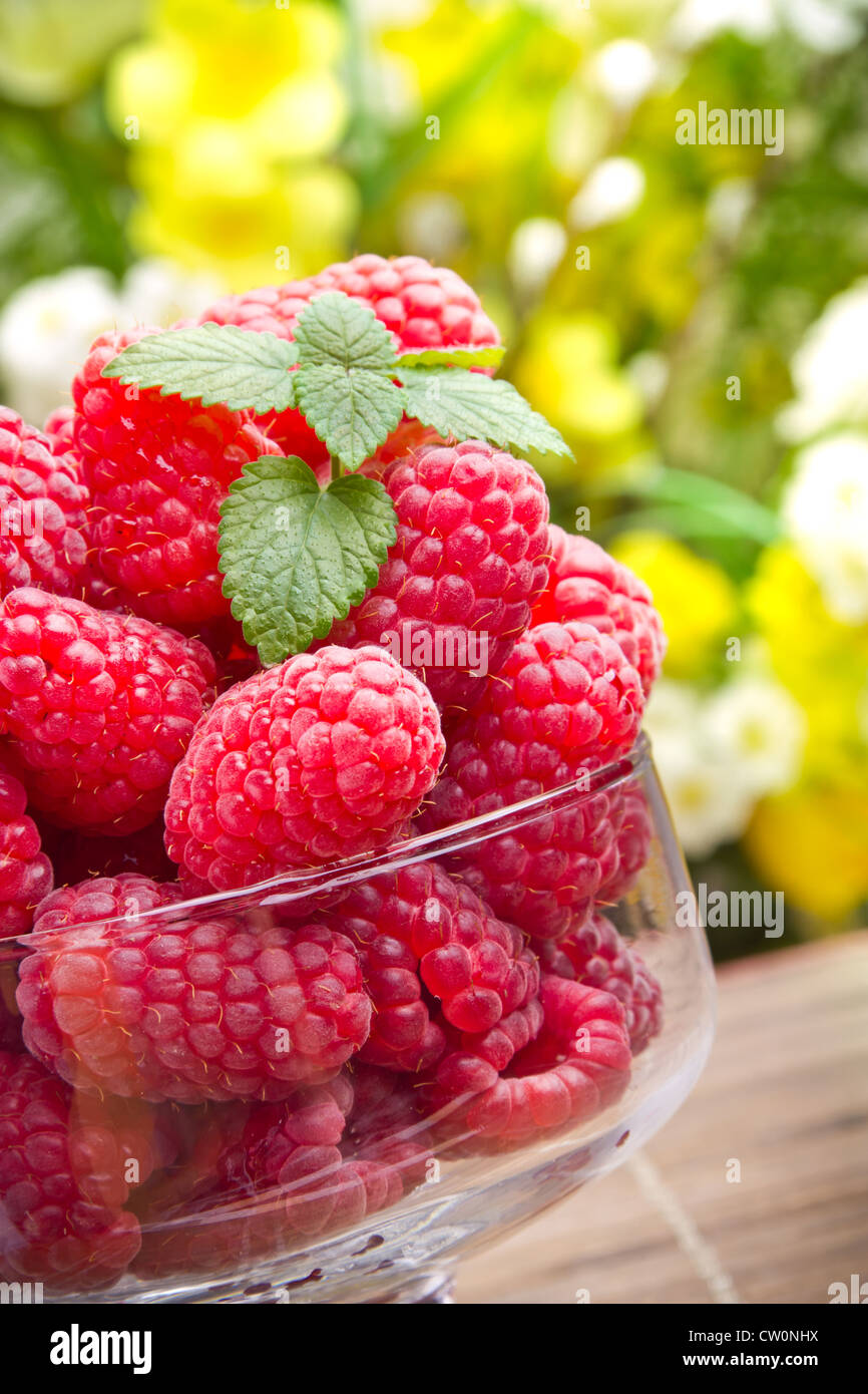 Sweet fresh raspberry fruits in glass goblet Stock Photo - Alamy
