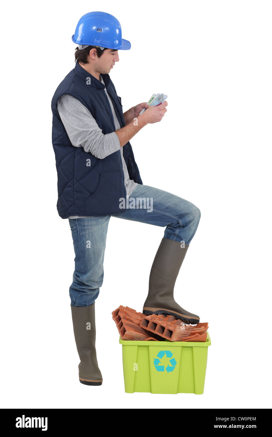 Worker counting money Stock Photo - Alamy