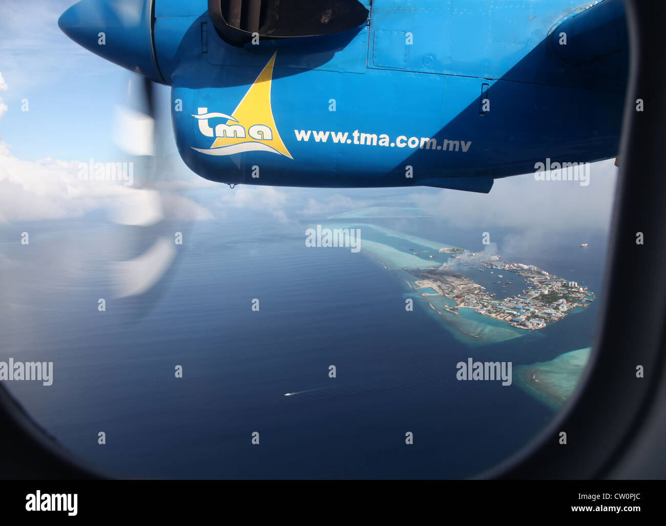 Seaplane of Trans Maldivian Airways flying above Maldives islands Stock ...