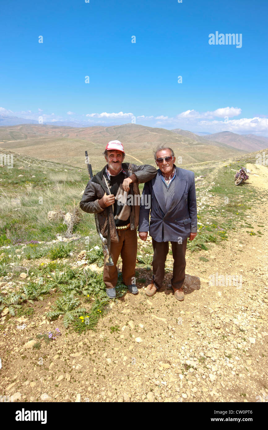 Mountain village hunter with his lift and rifle on the main road from ...