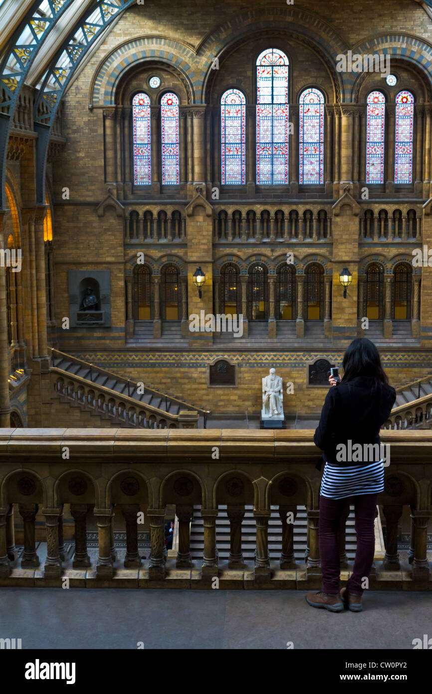 Tourist taking a picture of the Charles Darwin Statue in the Natural ...