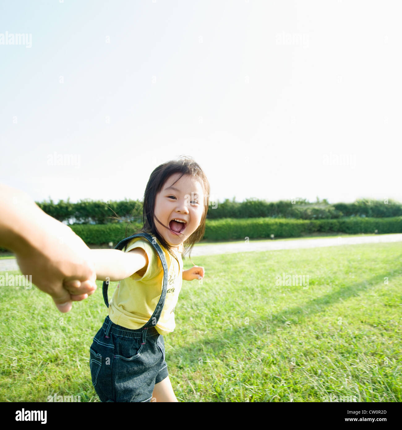 A girl pulling a hand Stock Photo - Alamy