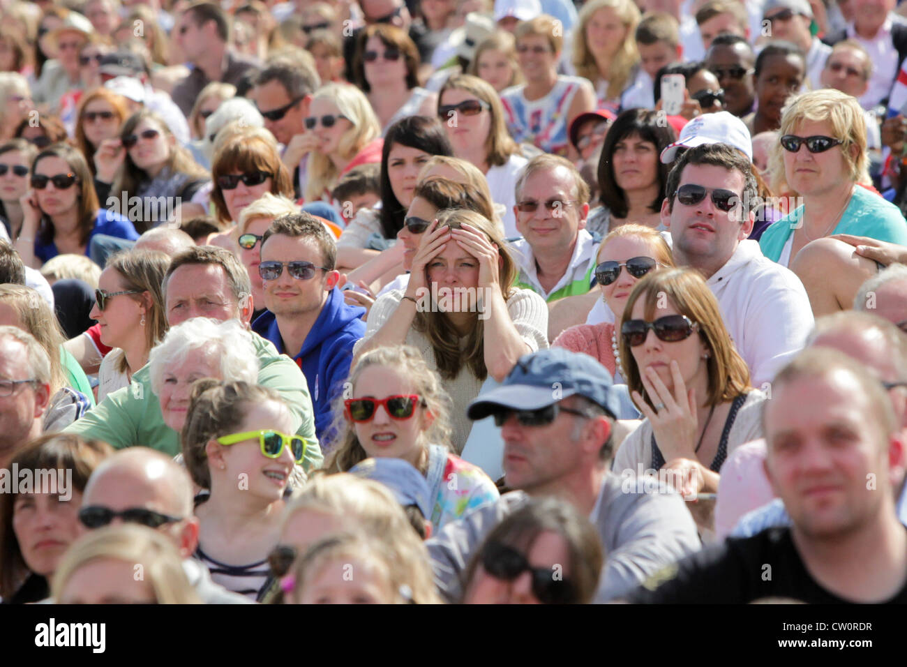 SPECTATORS WATCHING THE BIG TV SCREEN AT THE OLYMPIC GAMES LONDON 2012 ...