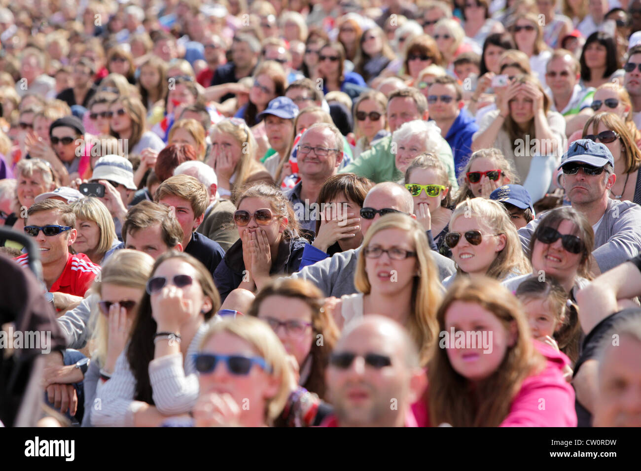 SPECTATORS WATCHING THE BIG TV SCREEN AT THE OLYMPIC GAMES LONDON 2012 ...