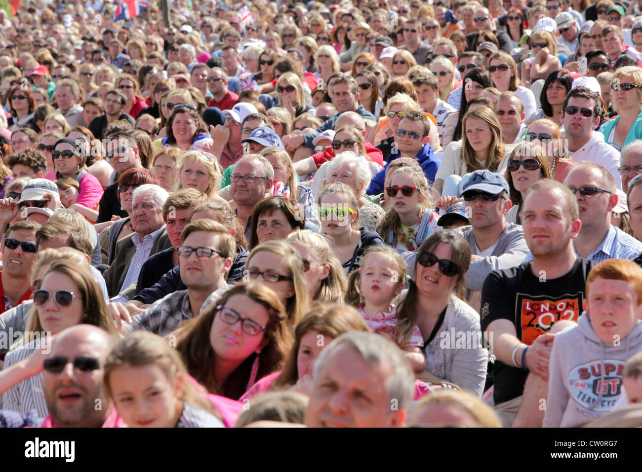 SPECTATORS WATCHING THE BIG TV SCREEN AT THE OLYMPIC GAMES LONDON 2012 ...
