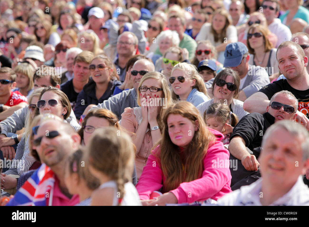 SPECTATORS WATCHING THE BIG TV SCREEN AT THE OLYMPIC GAMES LONDON 2012 ...