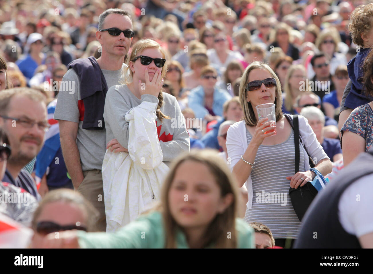 SPECTATORS WATCHING THE BIG TV SCREEN AT THE OLYMPIC GAMES LONDON 2012 ...