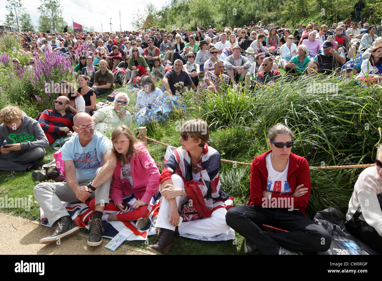 SPECTATORS WATCHING THE BIG TV SCREEN AT THE OLYMPIC GAMES LONDON 2012 ...