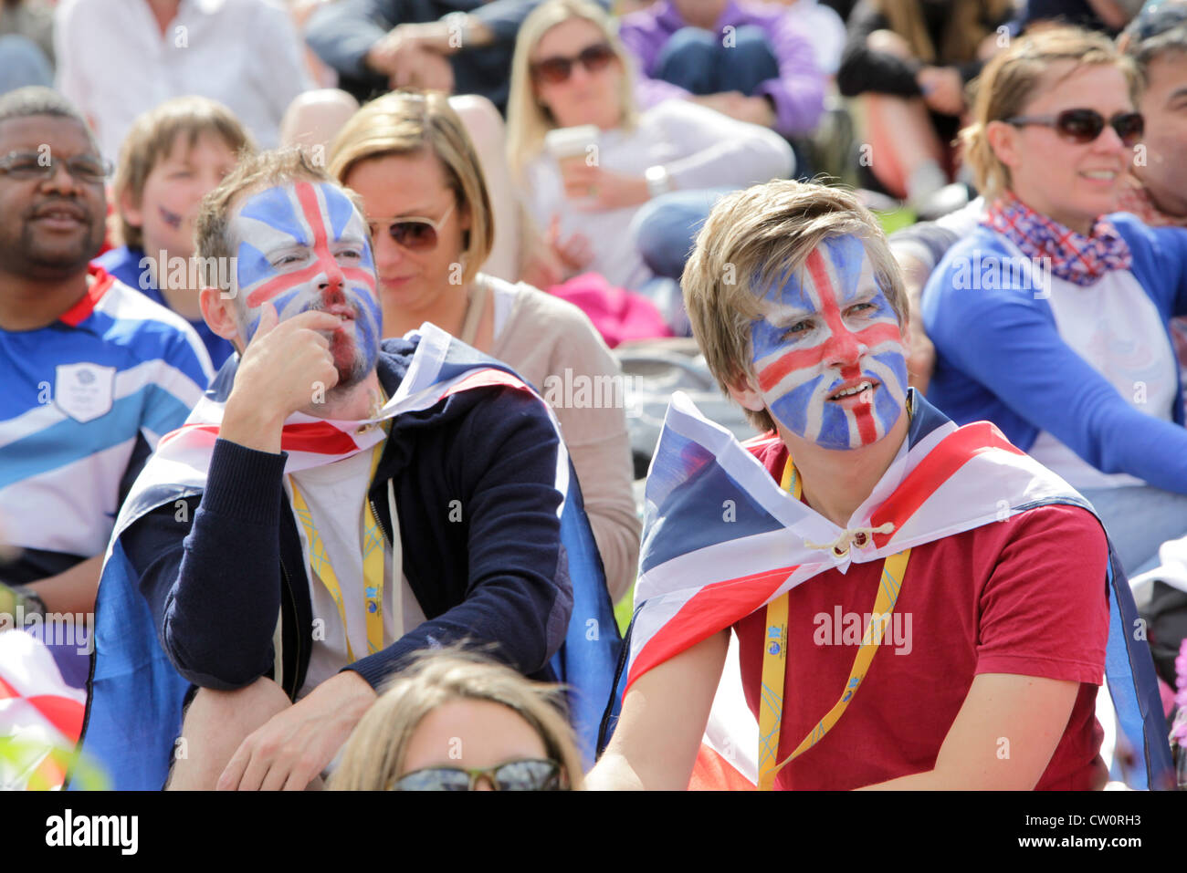 SPECTATORS WATCHING THE BIG TV SCREEN AT THE OLYMPIC GAMES LONDON 2012 ...