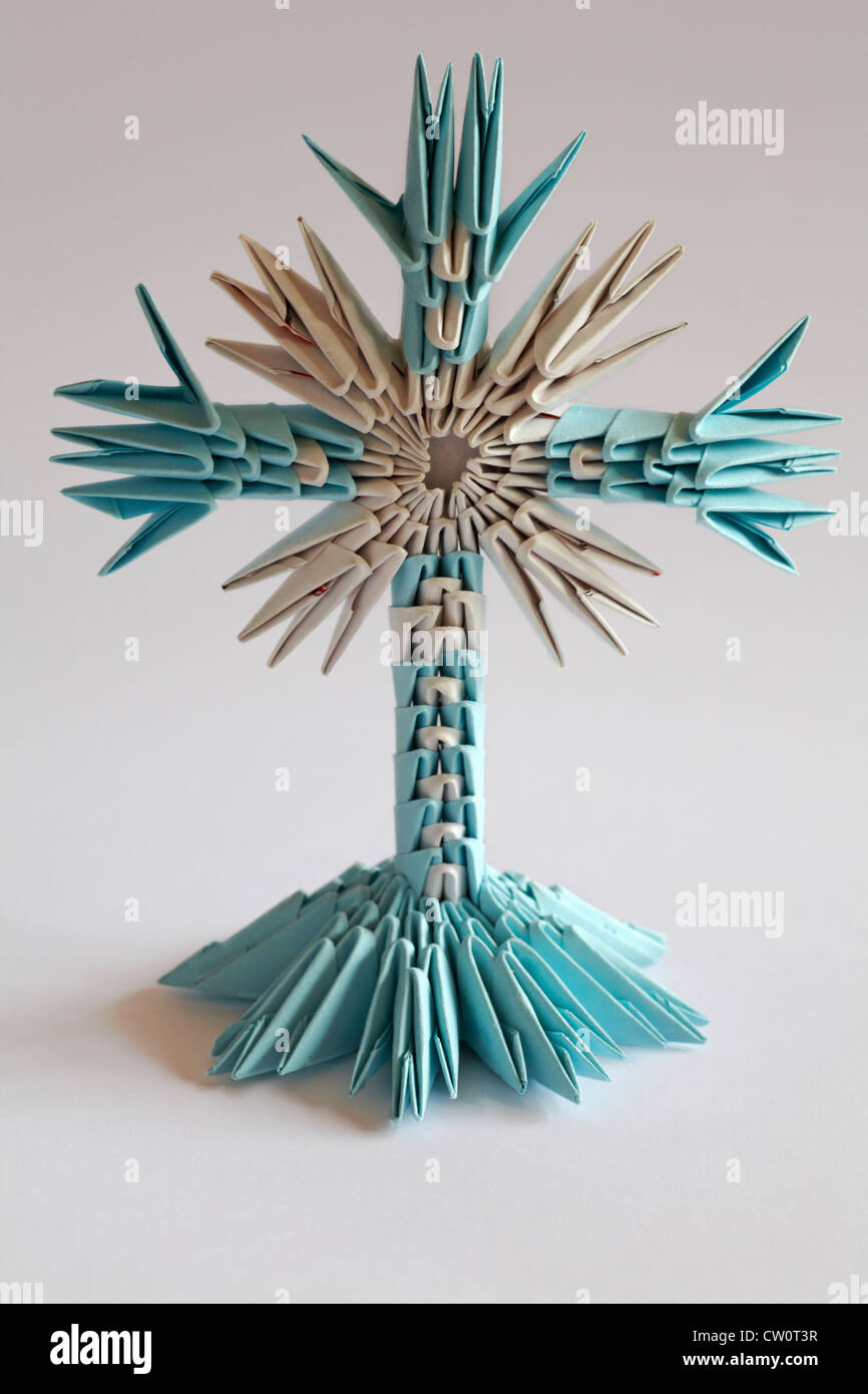 Origami blue and cream cross isolated on white background Stock Photo ...