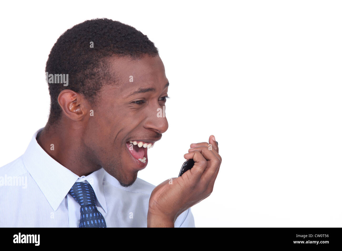 Closeup of a man shouting into his cellphone Stock Photo - Alamy