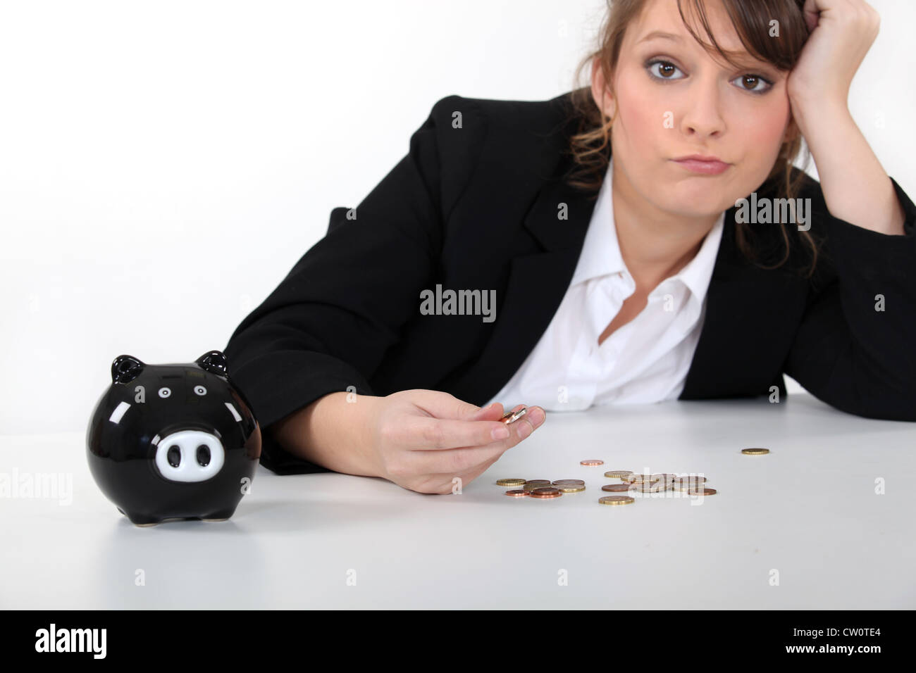 Woman counting coins Stock Photo - Alamy