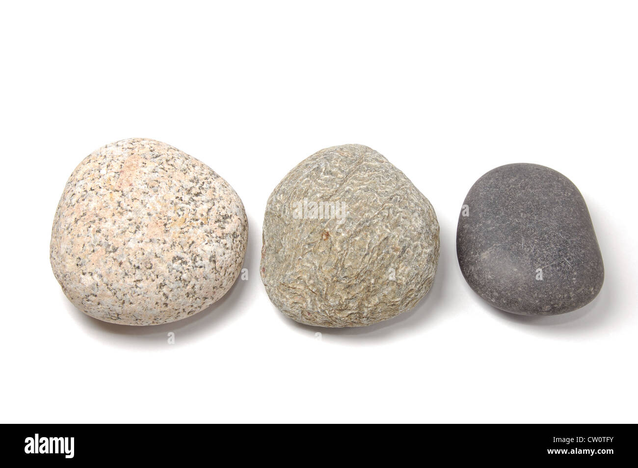 Row of assorted pebbles isolated on a white background Stock Photo - Alamy