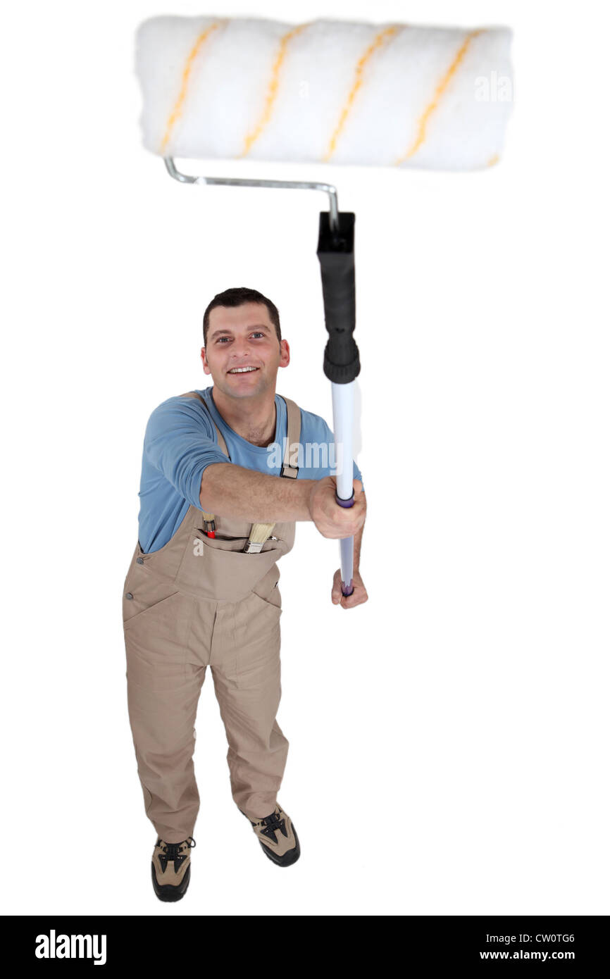 Man using paint roller Stock Photo - Alamy